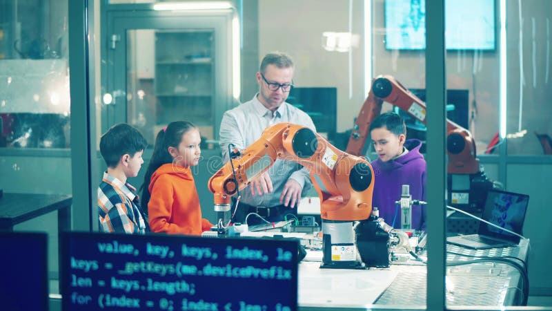 Robotics Lab with Kids and a Male Tutor. Technology, School Education ...