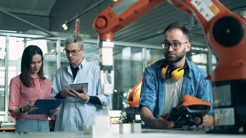 Group of Students, Young Engineers Testing Robot. Laboratory with ...