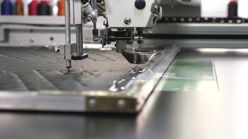 Robotics Works in the Tailoring Production Line. Robot Sewing Machine ...