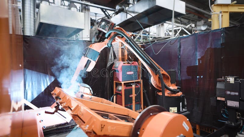 A Robotized Welding Machine in a High-tech Manufacturing Plant. a ...