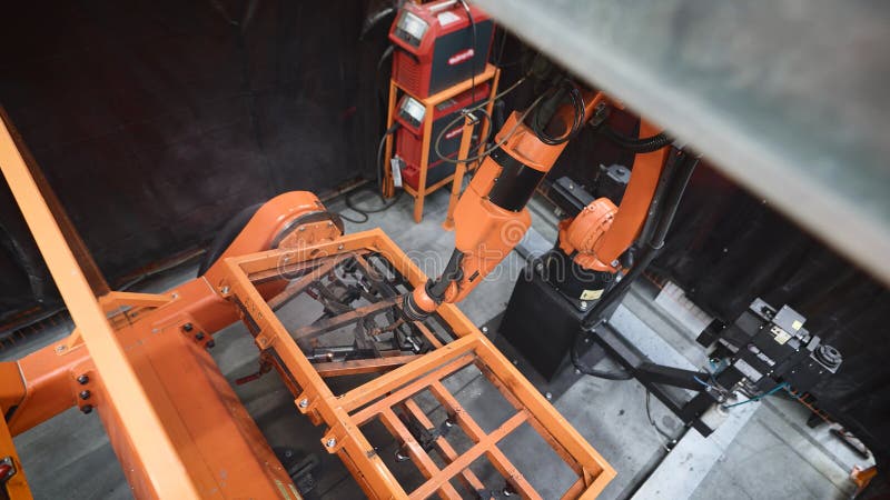 A Robotized Welding Machine in a High-tech Manufacturing Plant. a ...