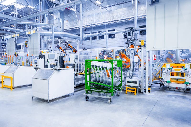Robots in a car plant stock image. Image of mechanical - 249602719