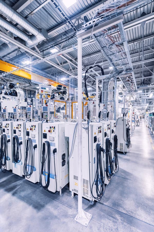 Robots in a car plant stock photo. Image of manufacturing - 261444698