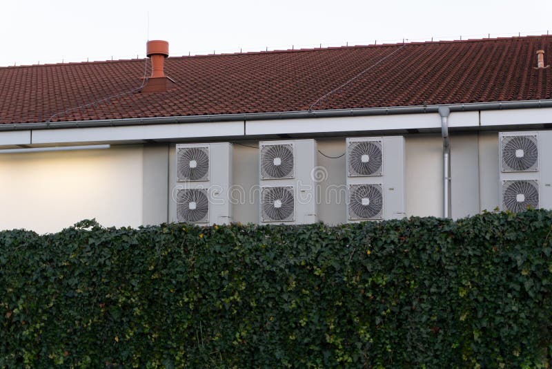HVAC System Installed on the Side of an Industrial Building with a Red ...