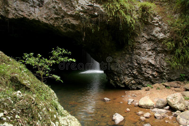 Rock arch and waterfall stock image. Image of cascading - 1442169