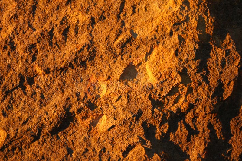 Rock Background In Yellow Light Stock Photo - Image of surface, ancient ...