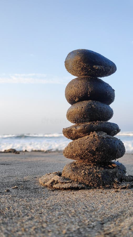 Rock Balancing on beach stock image. Image of rock, beach - 219861327