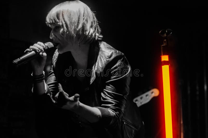 Rock Band Lead Singer Wearing Black Jacket And Wireless Microphone ...