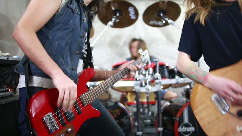 Rock Band with Guitarists and Drummer at Concert in Street at Night ...