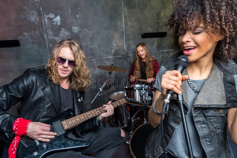 Rock Band Rehearsing in Musical Studio, Band on Stage Concept Stock ...