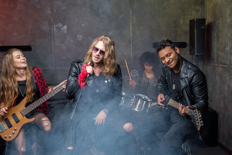 Rock Band Rehearsing in Musical Studio, Band on Stage Concept Stock ...