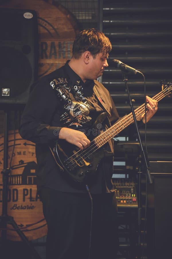 Rock band on a scene. editorial image. Image of guitar - 104494650