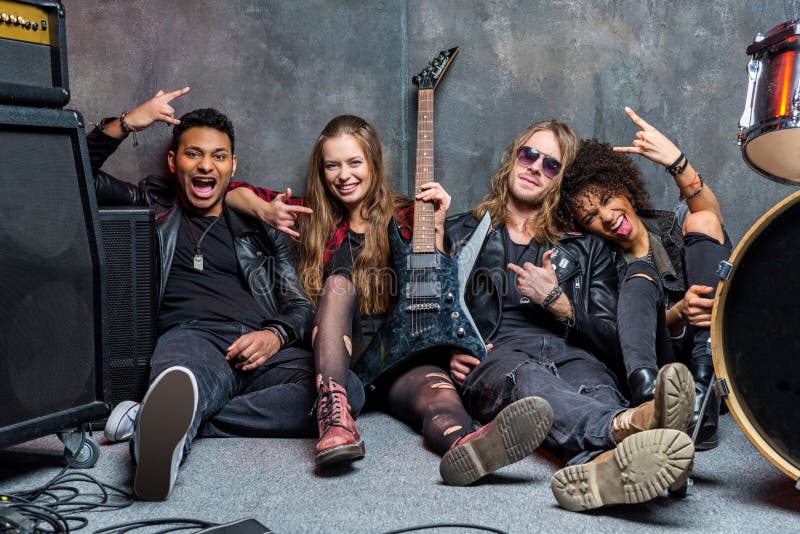 Rock Band Sitting on Floor while Resting after Rehearse Stock Image ...