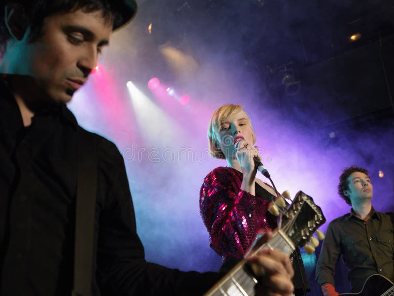 Rock Band on Stage stock image. Image of performer, group - 31835453