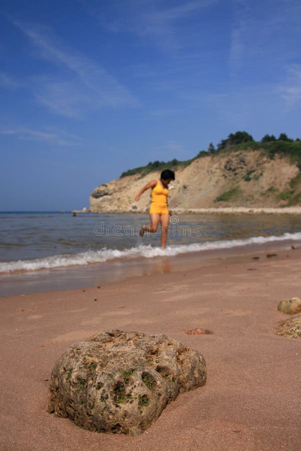 Rock on Beach stock photo. Image of rock, active, beach - 3575356