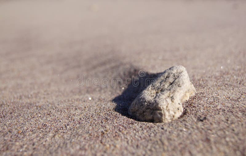 Rock in beach sand stock photo. Image of shadow, alone - 29282586