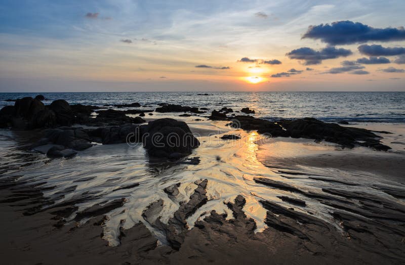 Rock Beach Sunset with Beautiful Cloudscape Skyline Stock Photo - Image ...
