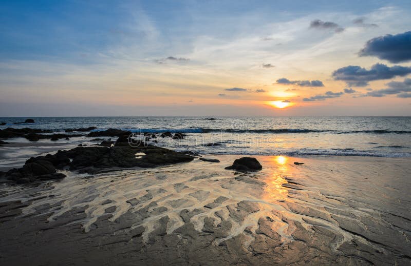 Rock Beach Sunset with Beautiful Cloudscape Skyline Stock Image - Image ...