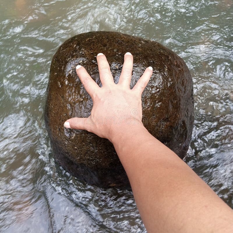 The Rock is Bigger Than the Hand Stock Photo - Image of organ, sand ...