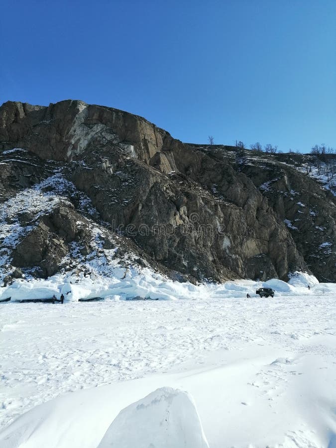 Ice and Rock Winter Landscape with Sunshine Blue Sky and White Fresh ...