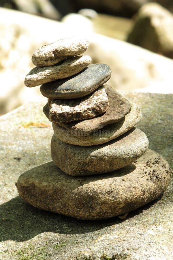 Rock cairn and shadow stock image. Image of stone, shadow - 193067651