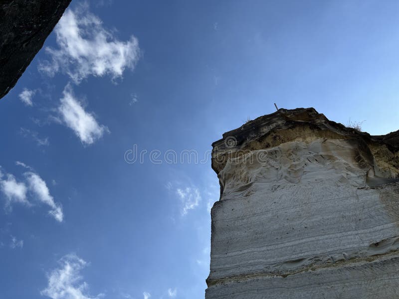 Rock Cliff with Clear Blue Sky on the Background Stock Photo - Image of ...
