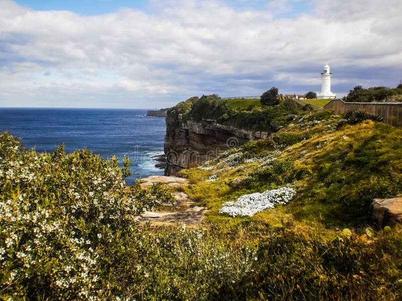 Rock Cliff and Lighthousebeside the Sea Stock Image - Image of chimney ...