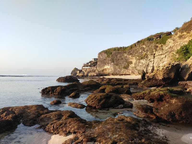 Rock cliffs on the beach stock image. Image of coast - 250375677