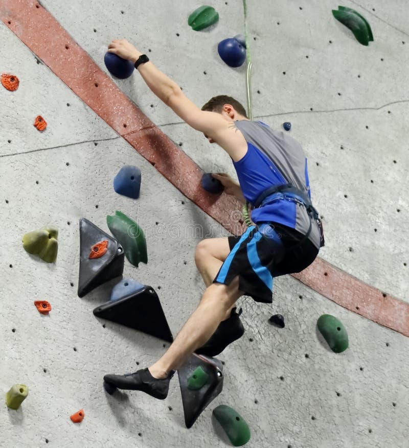 Climber Flagging on Green Holds Stock Image - Image of challenge ...