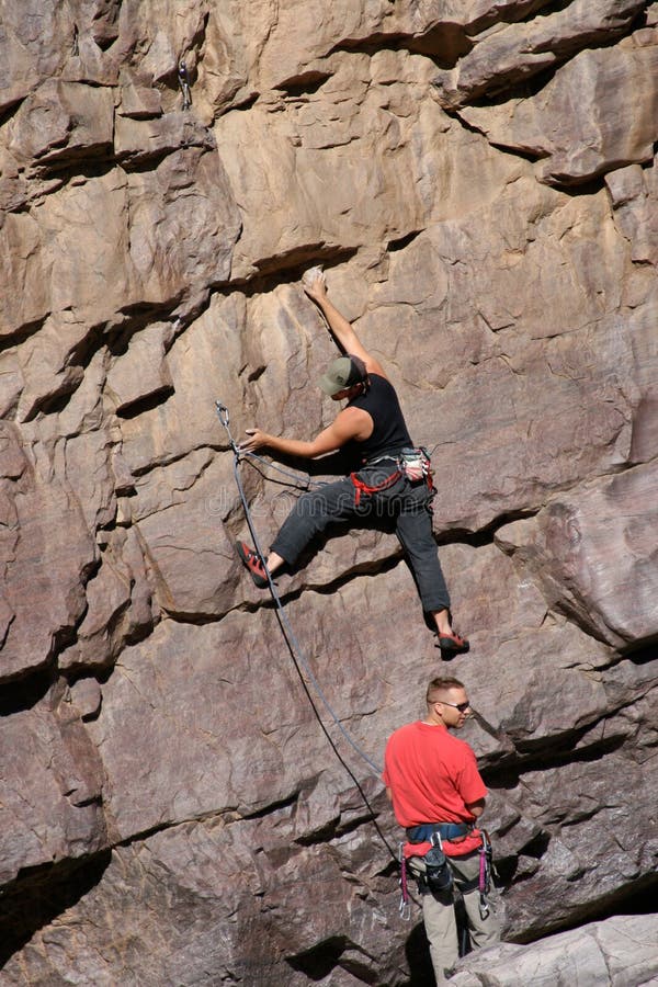 Rock climber with belayer stock image. Image of braced - 3470891