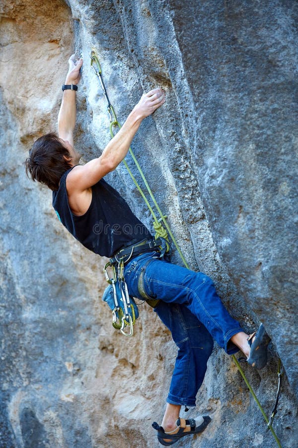 Rock Climber Climbing Up a Cliff Stock Photo - Image of male, fitness ...