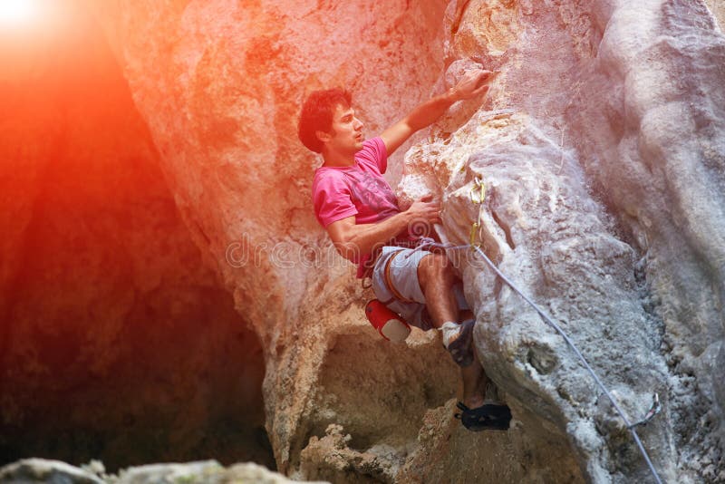 Rock Climber Climbing Up a Cliff Stock Photo - Image of island ...