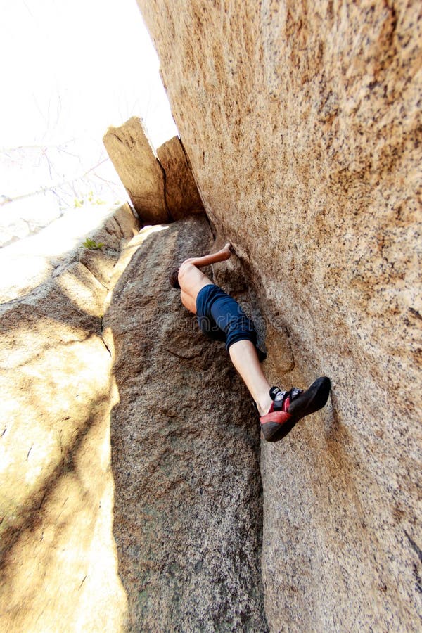 Rock Climber Climbs a Boulder Over a Rock without Insurance Stock Photo ...
