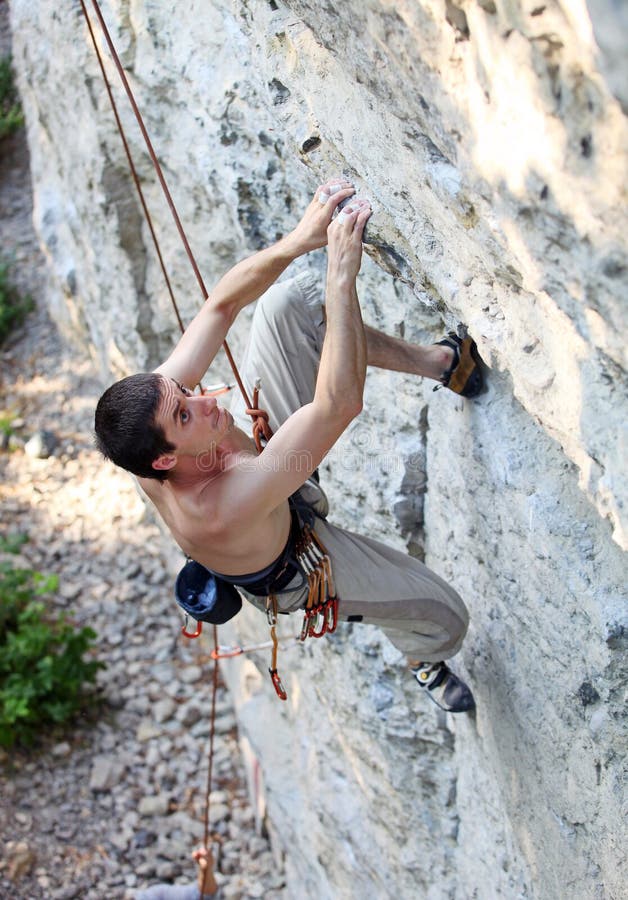 Rock Climber Focusing On The Next Movement Stock Image - Image of ...