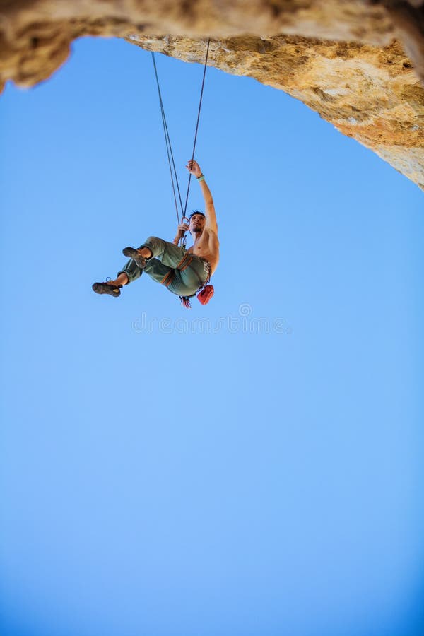 Rock Climber Hanging on Rope Stock Photo - Image of high, happiness ...