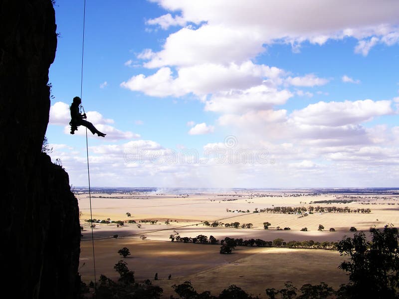 Rock climber rappelling stock photo. Image of females - 2569026
