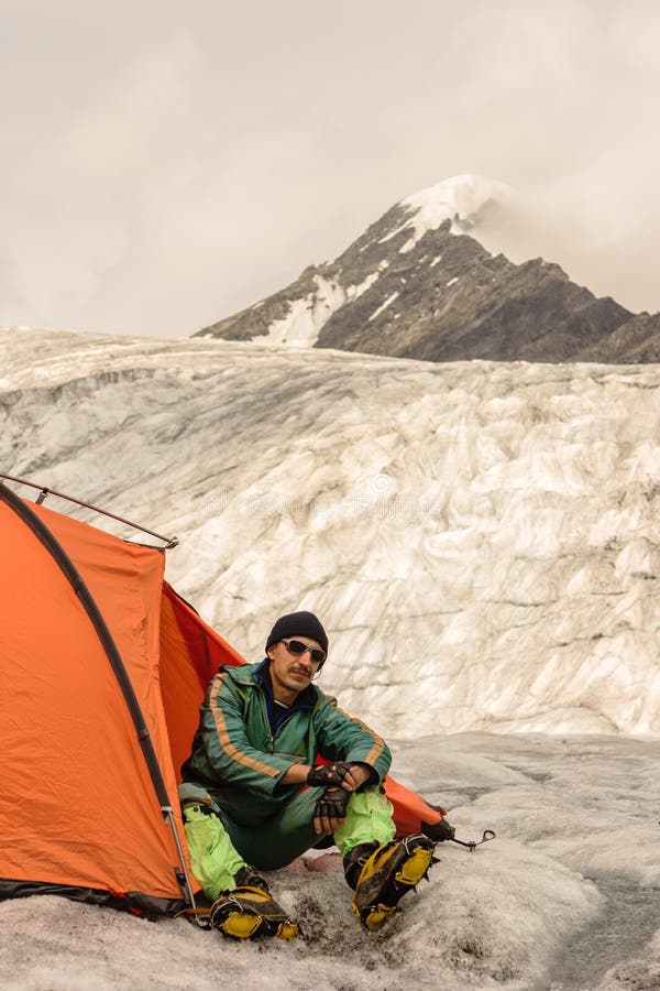 The Rock-climber in Tent Looks To Tops Mountains Stock Photo - Image of ...