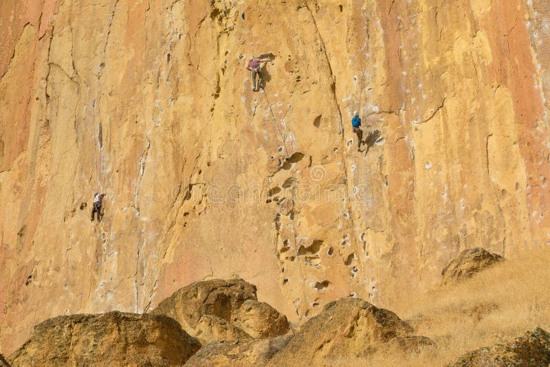 Rock Climbers Climb a Large Rock, Filmed from the Back Stock Image ...