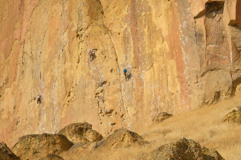 Rock Climbers Climb a Large Rock, Filmed from the Back Stock Photo ...