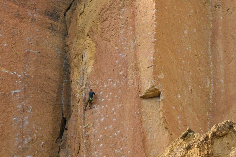Rock Climbers Climb a Large Rock, Filmed from the Back Stock Image ...