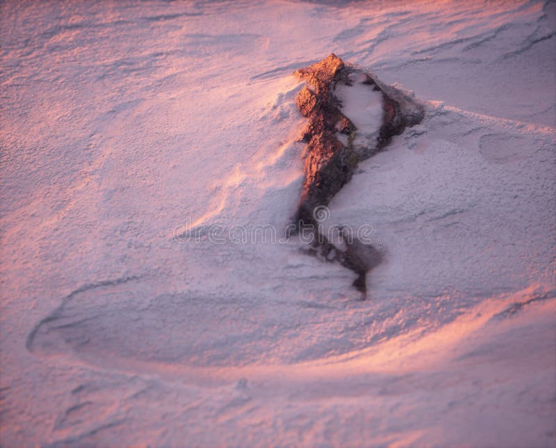 Rock Covered in Snow in Low Sunlight. Stock Image - Image of sunlight ...