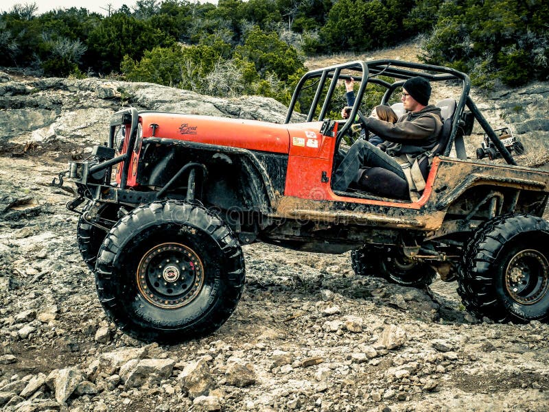 Orange Jeep Rock Crawling editorial photo. Image of comanche - 143021476