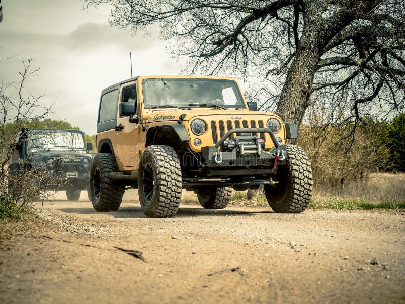 Orange Jeep Rock Crawling editorial image. Image of commander - 143024785