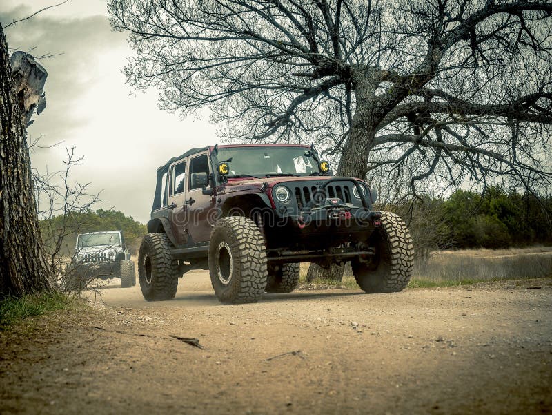 Orange Jeep Rock Crawling editorial image. Image of door - 143044785