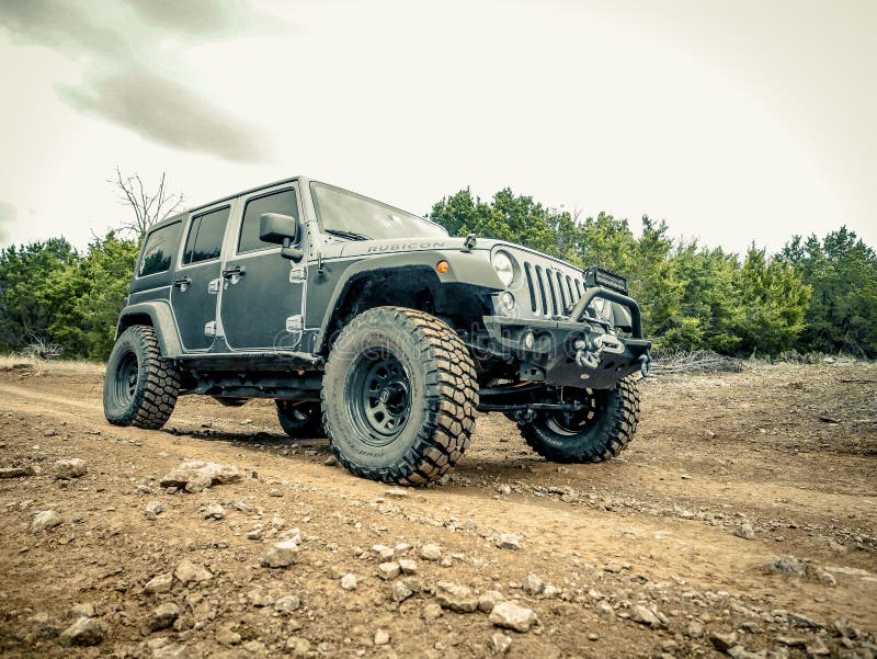Orange Jeep Rock Crawling editorial stock image. Image of green - 143051204