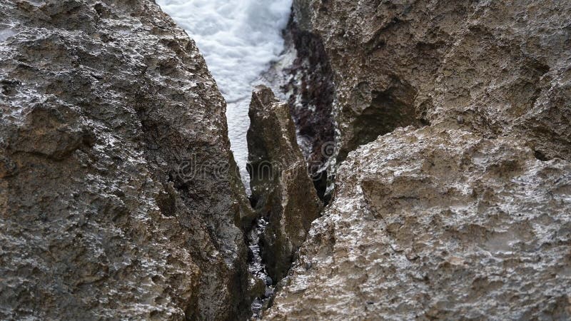Natural Rock Formation: Seawater Flowing through Crevice with Foam ...