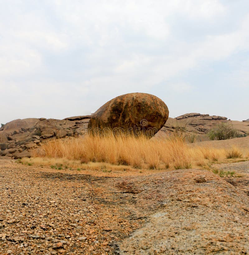 Rock among Dry Grass in an Arid Land Stock Photo - Image of natural ...