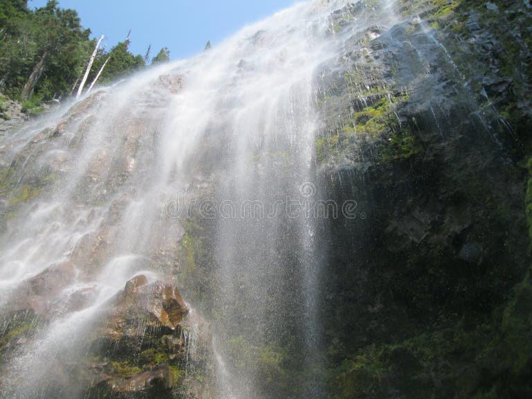 Rock face waterfall stock photo. Image of mist, clouds - 91830500