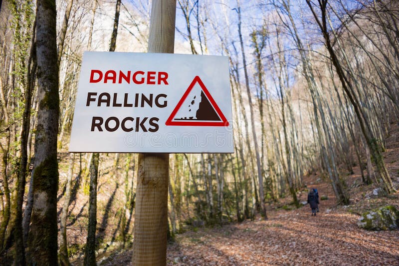 Rock Fall Danger Sign in the Forest People Walks Away Stock Image ...