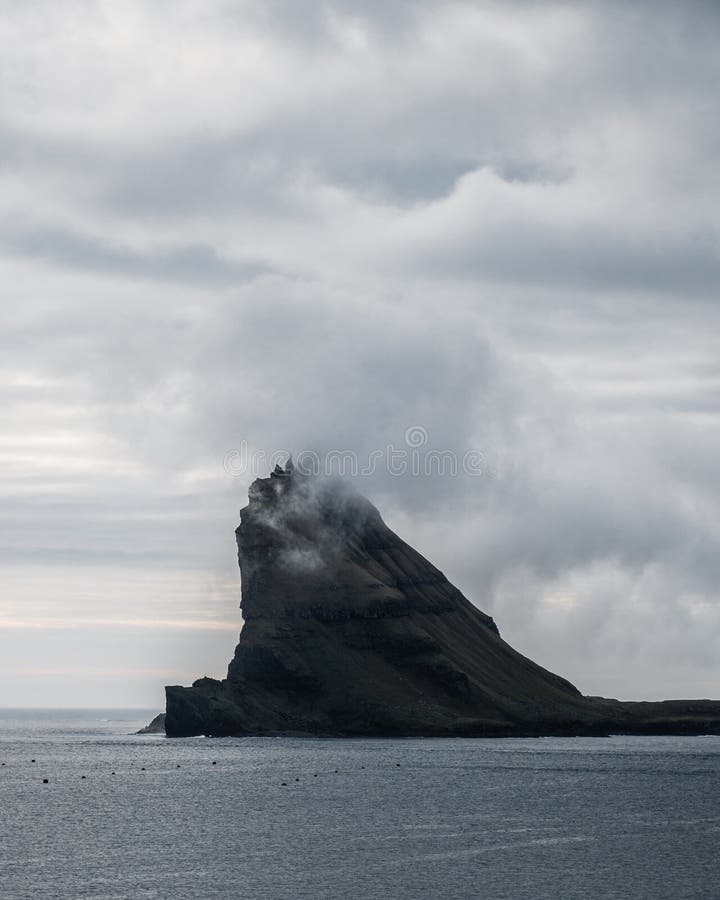 Rock Formation in the Atlantic Ocean. Towering Black Rock Formations in ...